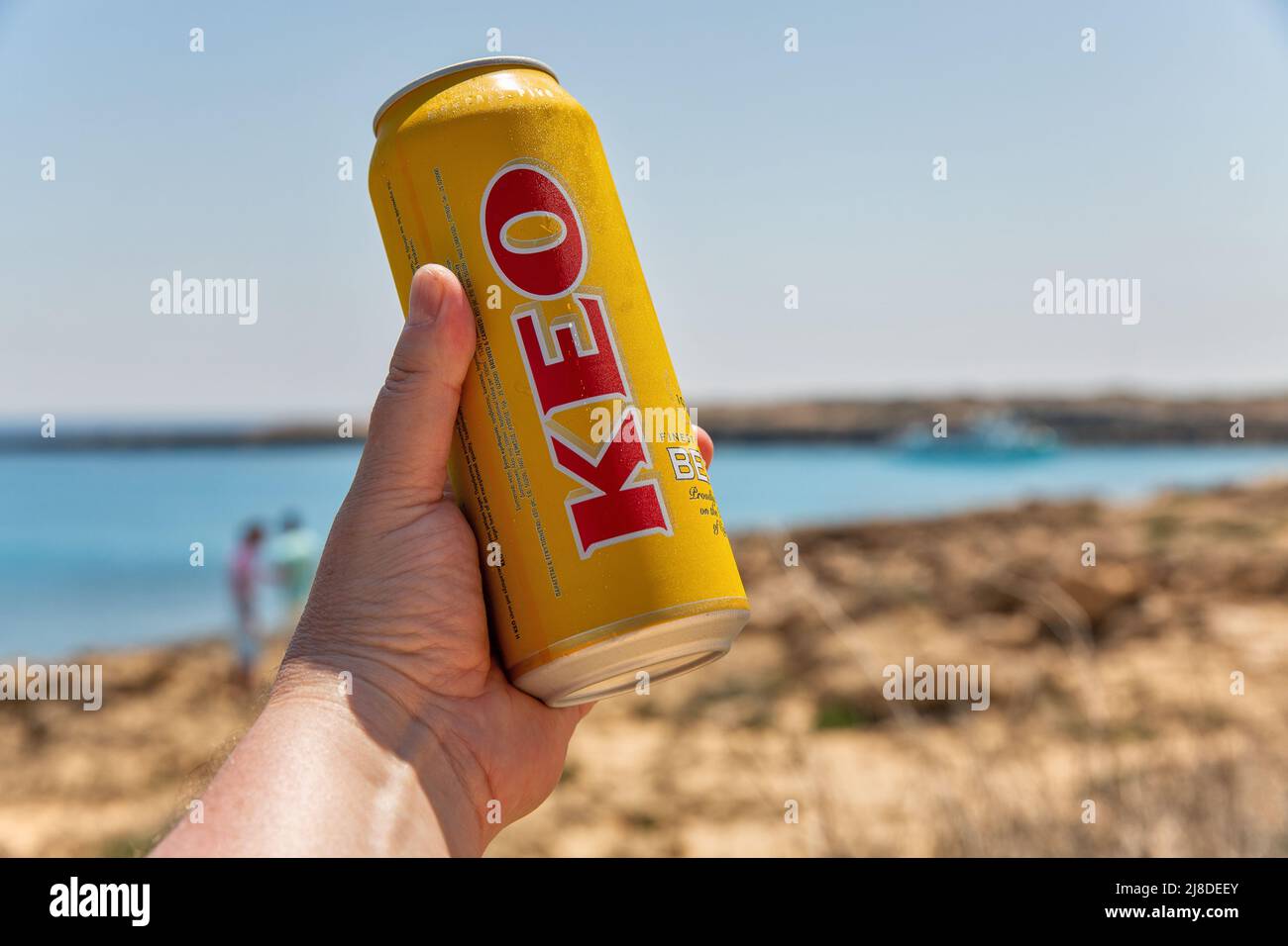 Ayia Napa, Cyprus - May 27, 2021: White man's hand holds a can of KEO ...