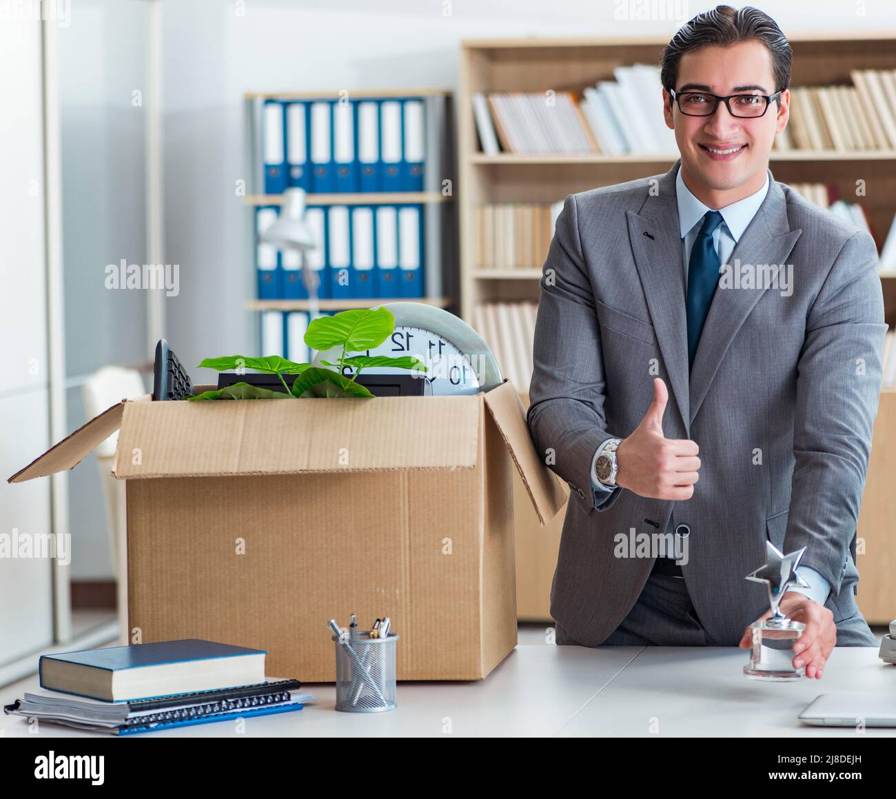 The man moving office with box and his belongings Stock Photo - Alamy