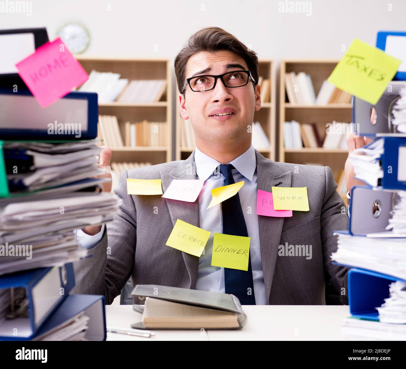 The businessman struggling with multiple priorities Stock Photo - Alamy