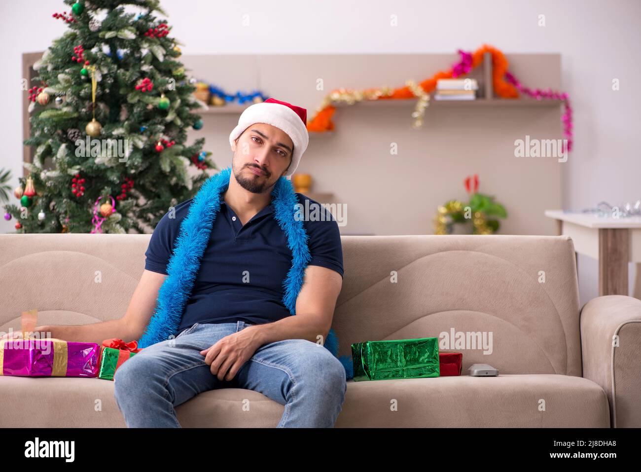 Young man celebrating New year at home alone Stock Photo - Alamy