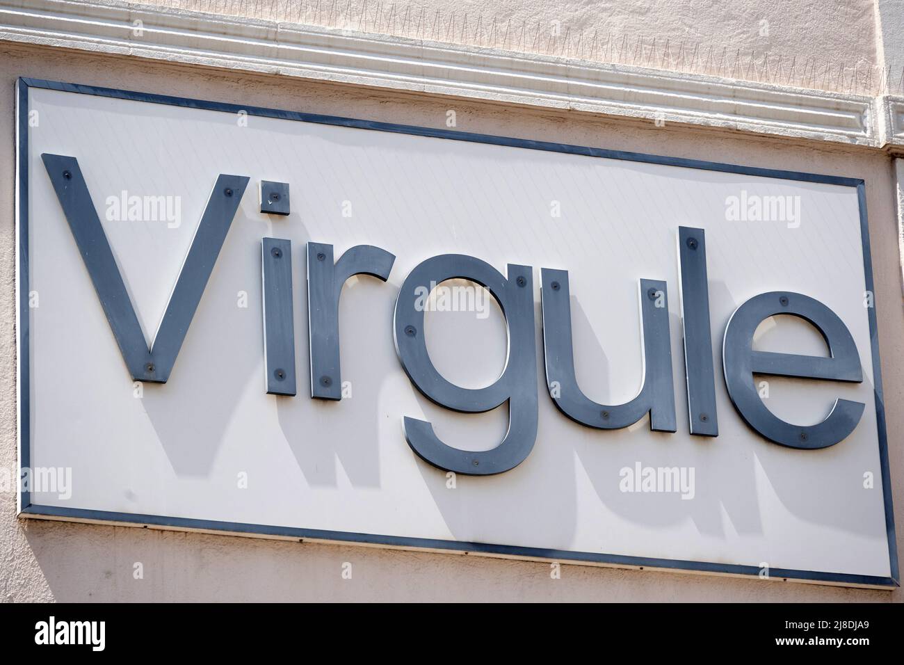 A shop sign of VIRGULE, on May 15, 2022 in Cannes, France. Photo by ...