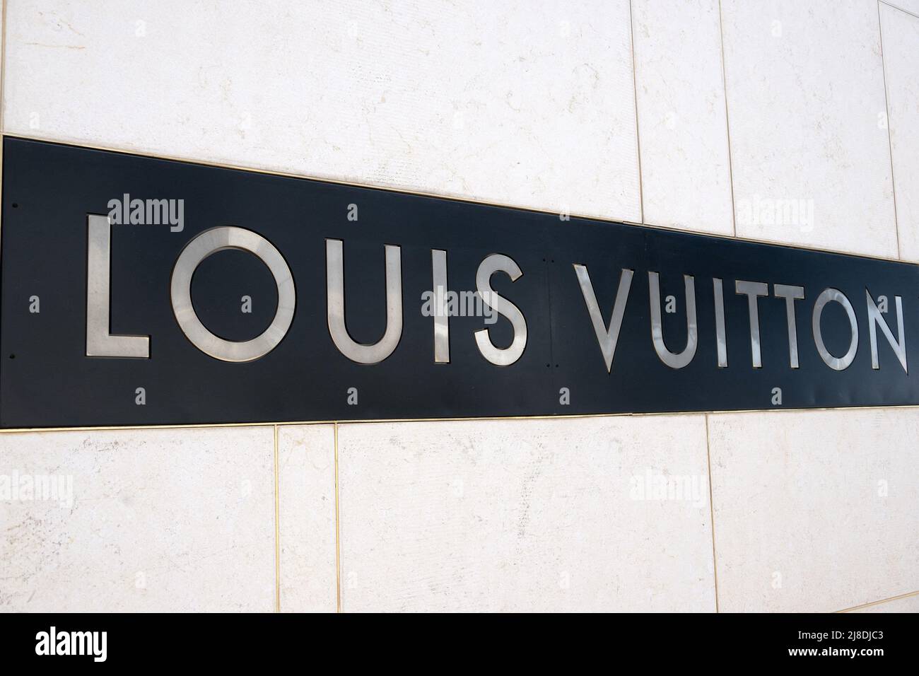 A shop sign of LOUIS VUITTON, on May 15, 2022 in Cannes, France. Photo ...