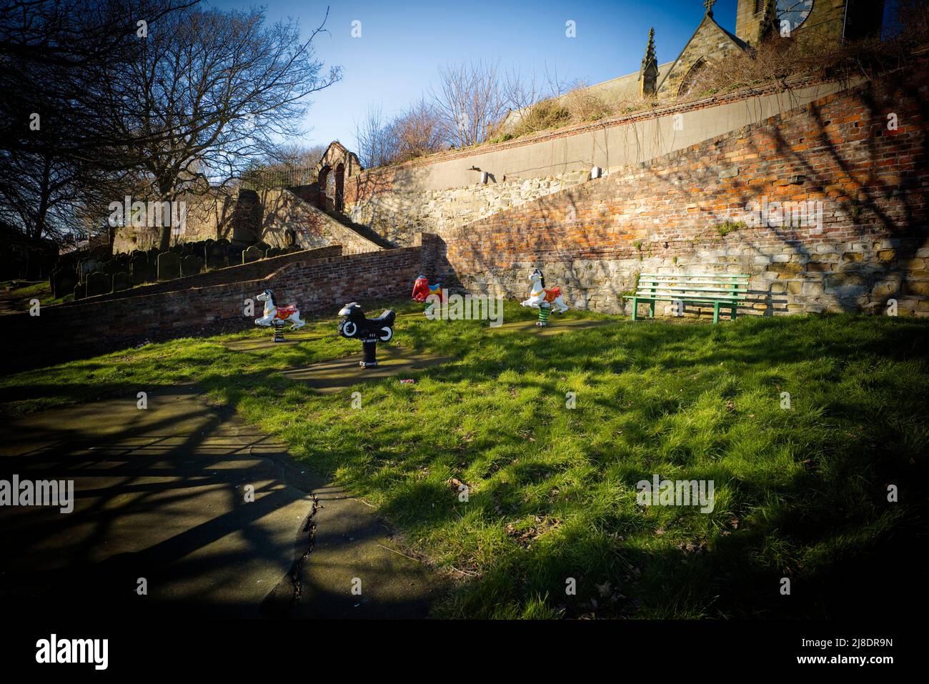 Spooky playground next to a graveyard in the old town at Scarborough ...