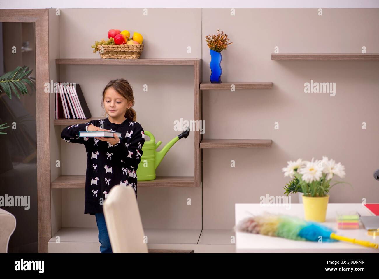 Housework schoolgirl hi-res stock photography and images - Alamy