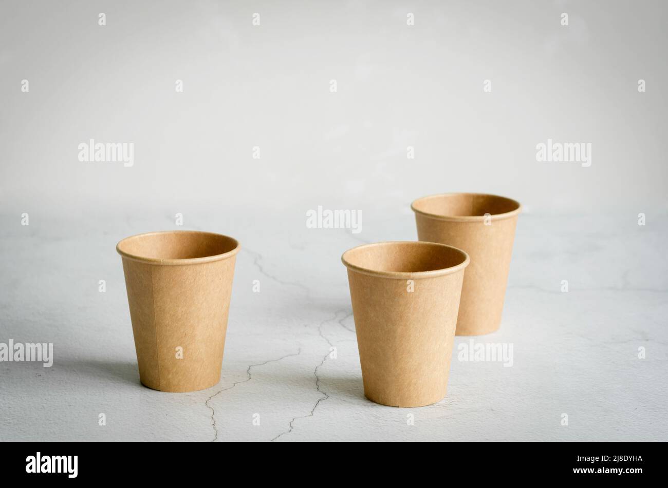 Empty three craft paper disposable cups mock up. Delivery food concept ...