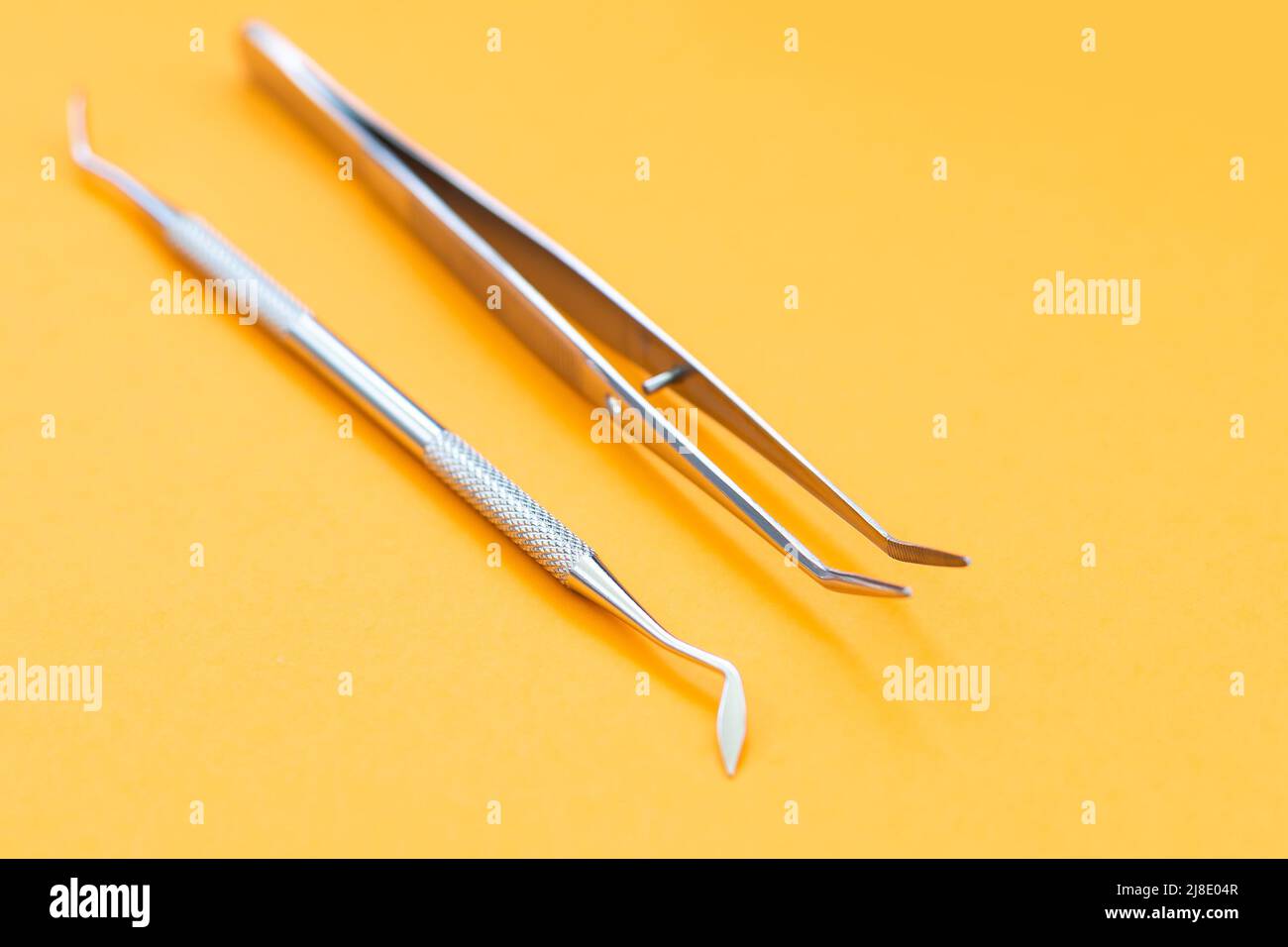 Professional Dentist tools in dental office: dentist mirror, forceps ...