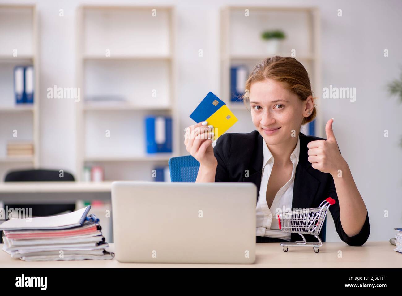 Female employee in e-commerce concept Stock Photo - Alamy