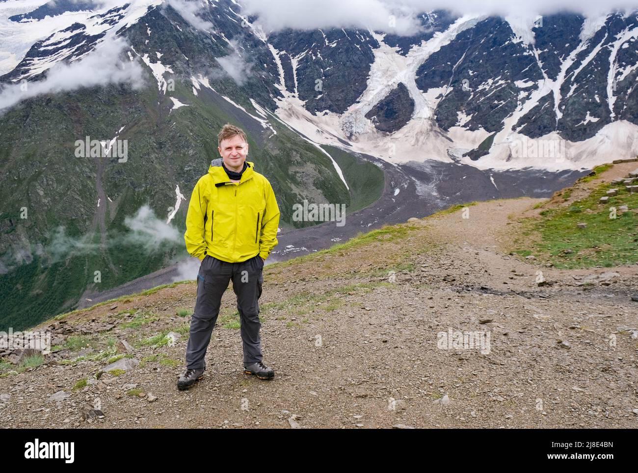 Male tourist in yellow jacket hi-res stock photography and images - Alamy