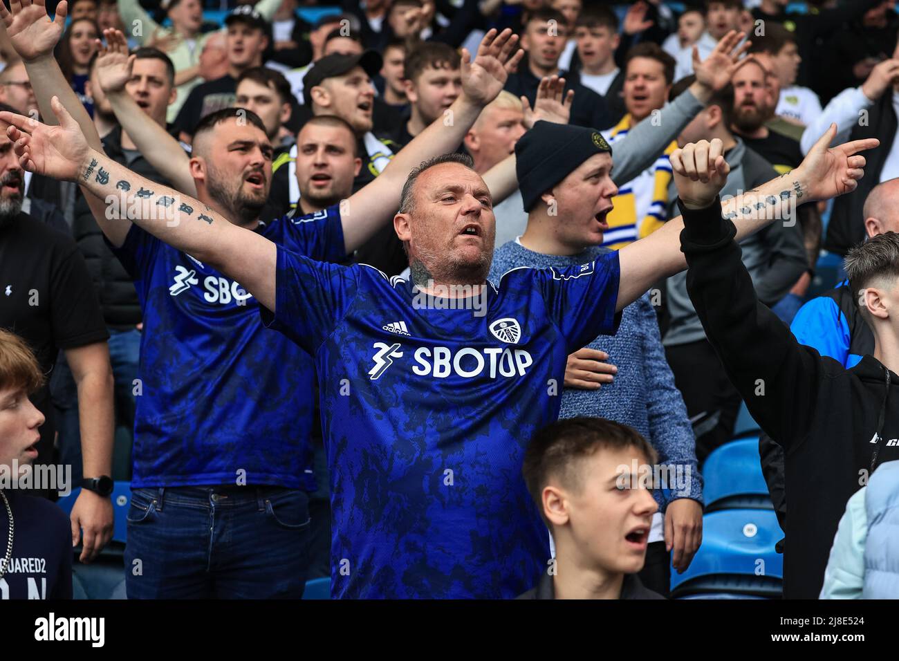 Leeds fans singing away Stock Photo - Alamy