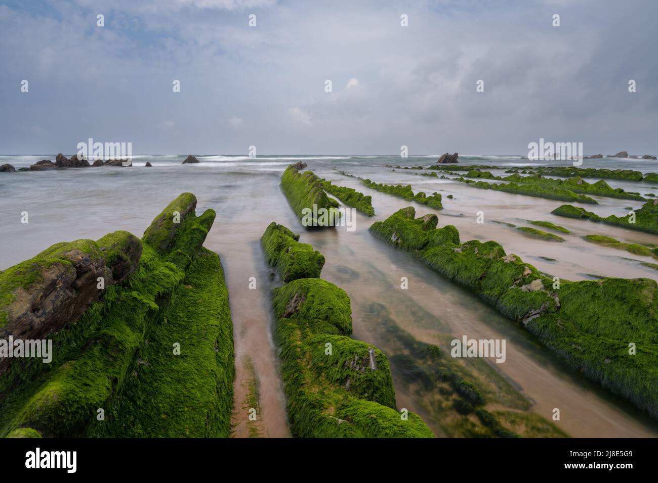 A long exposure view of Flysch rock formations at low tide at Barrika ...