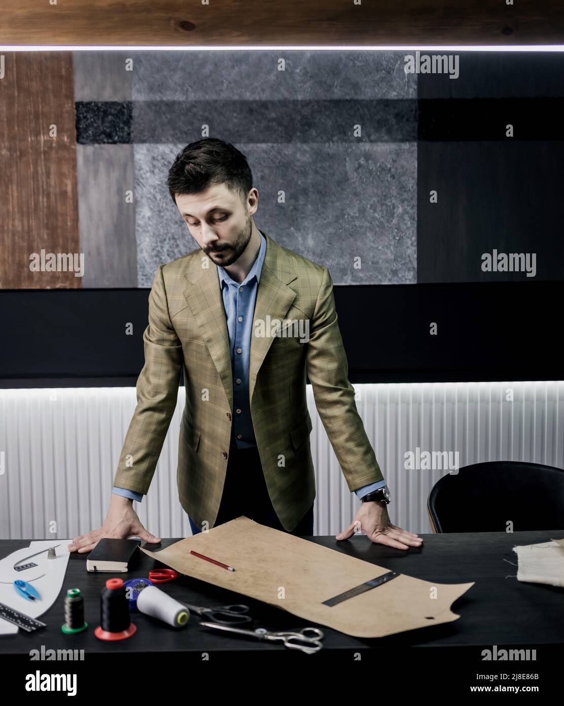 tailor at the atelier before starting work. the process of costume ...