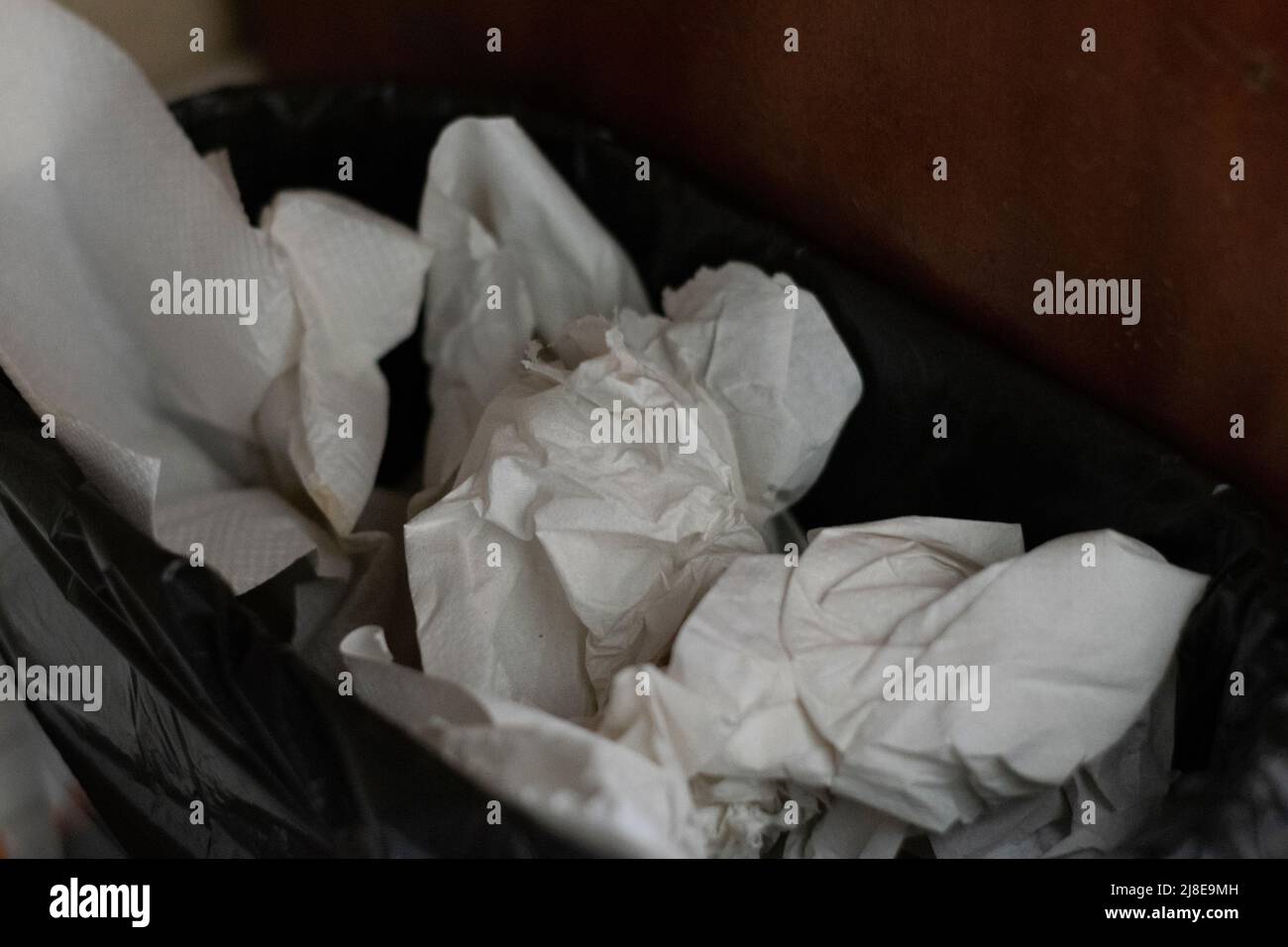 Dustbin with papers in the office Stock Photo - Alamy