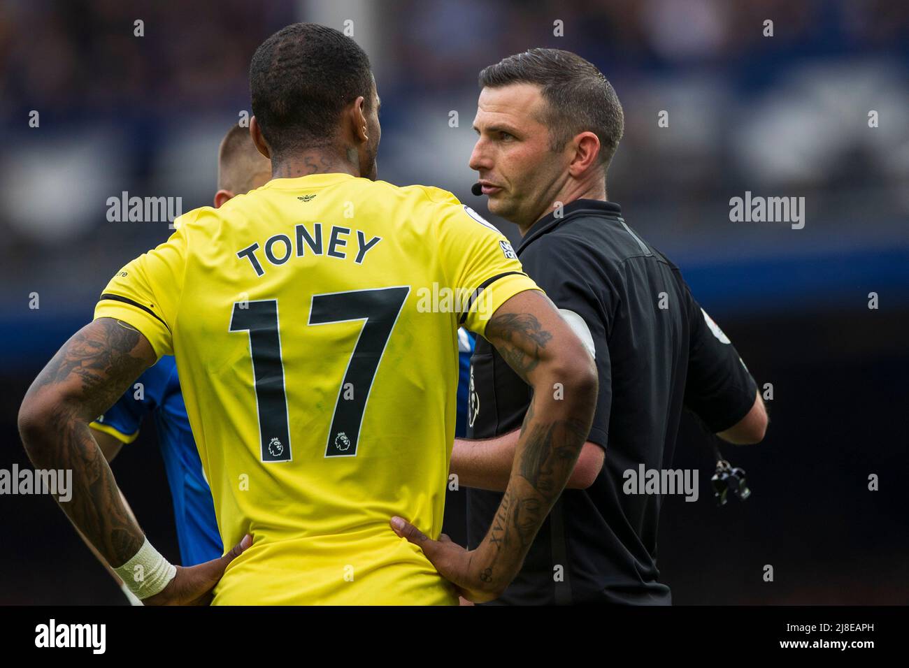 Referee Michael Oliver has a chat with Ivan Toney #17 of Brentford ...