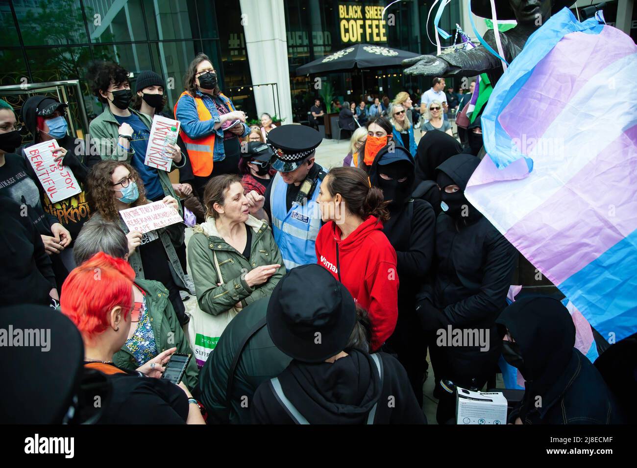 Pro and Anti trans protesters stand in the same area of the Emmeline ...