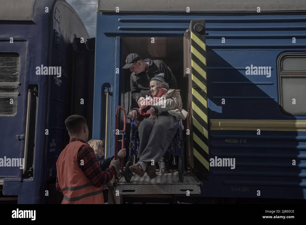 Kramatorks, Ukraine. 15th May, 2022. Volunteers helping a handicaped ...