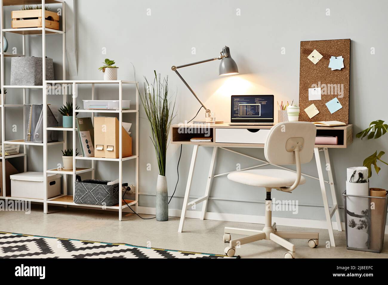Background image of white home office workplace with code on laptop ...