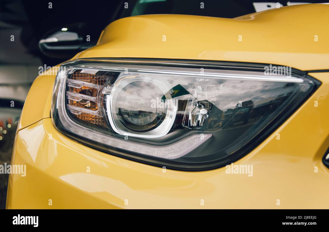 A close up image of a modern car's headlight. Modern lines Stock Photo ...