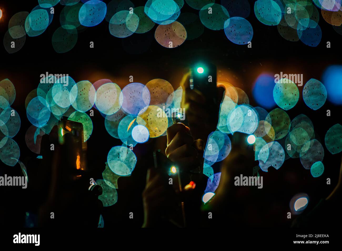 Hands with phones on concert, atmosphere on concert, stage lights Stock ...