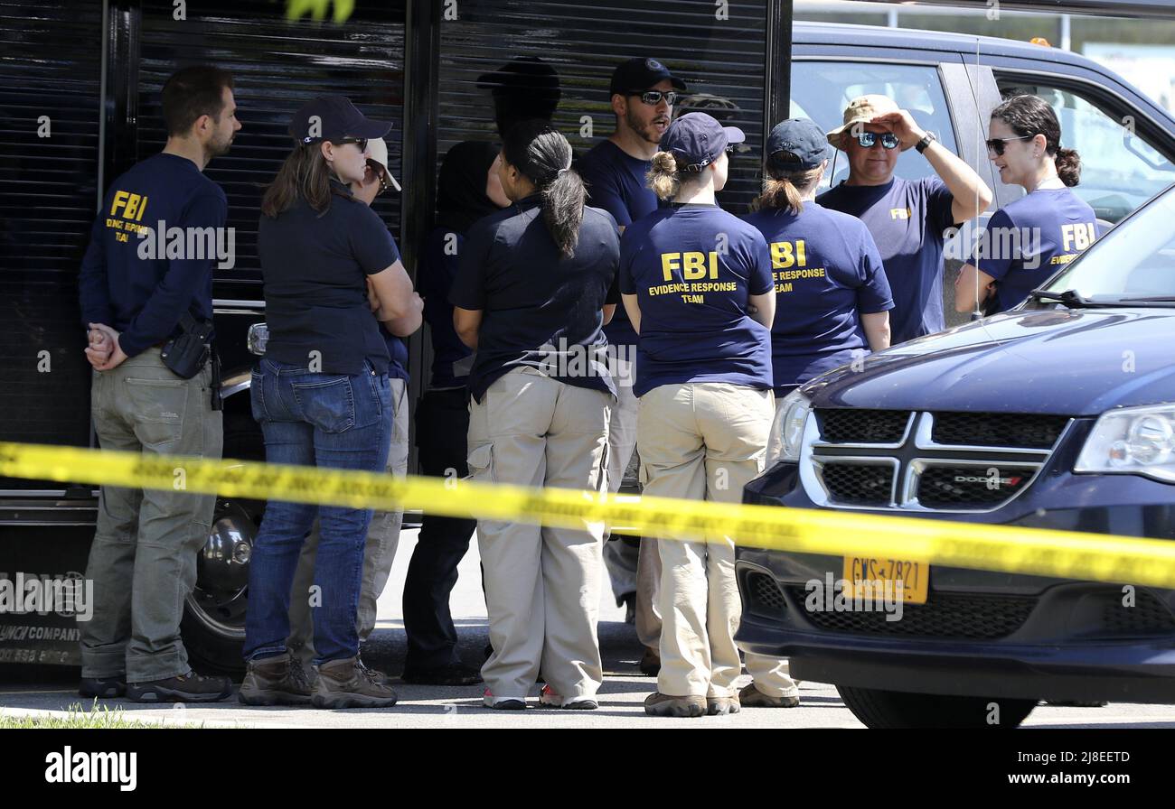 Buffalo, United States. 15th May, 2022. Members of the FBI evidence ...