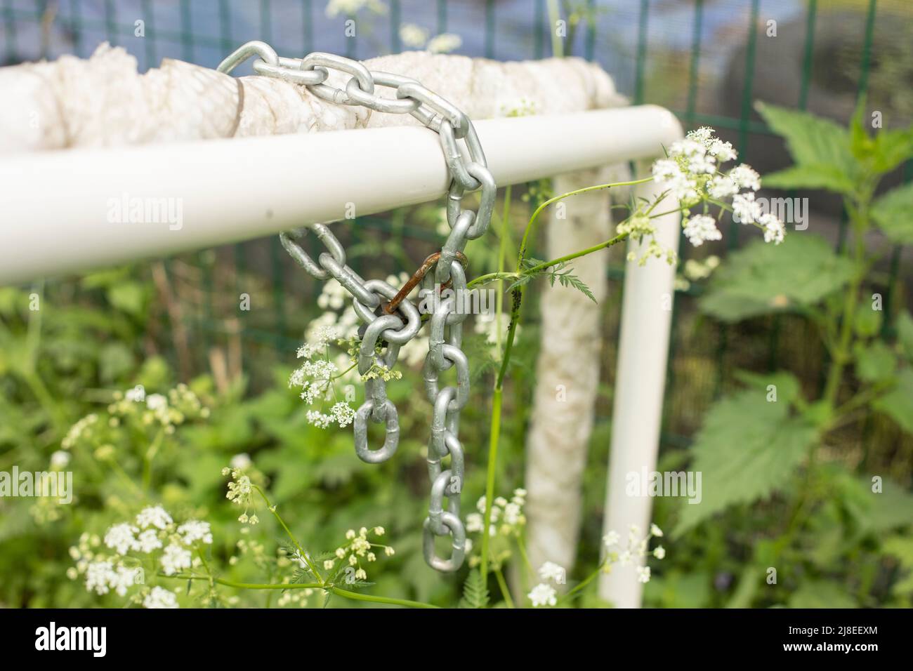 Chain on pipe. Chain connects two pipes. Pipeline details Stock Photo ...