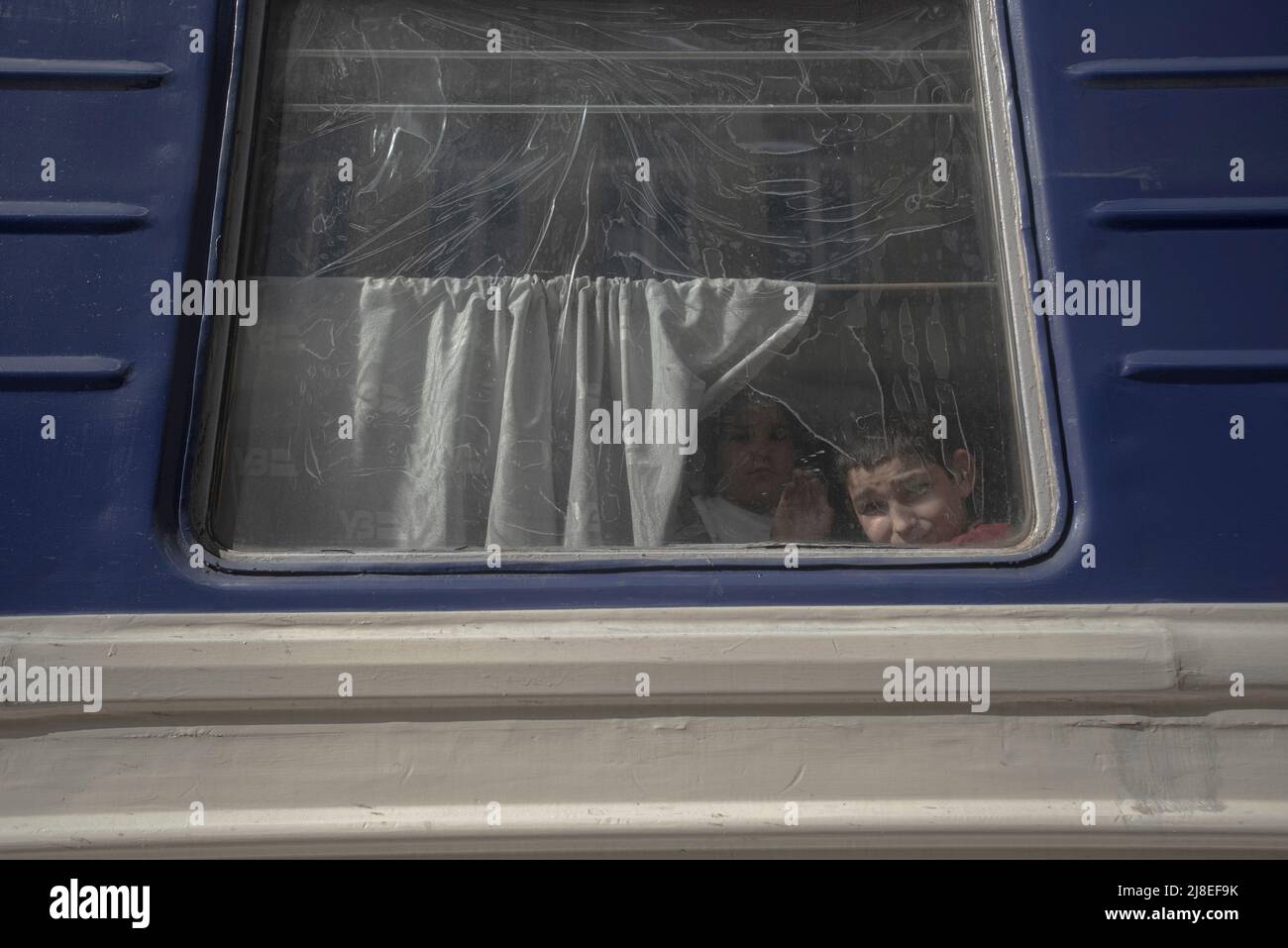 A child inside the train of Povrovsk to Dnipro, where people is going ...