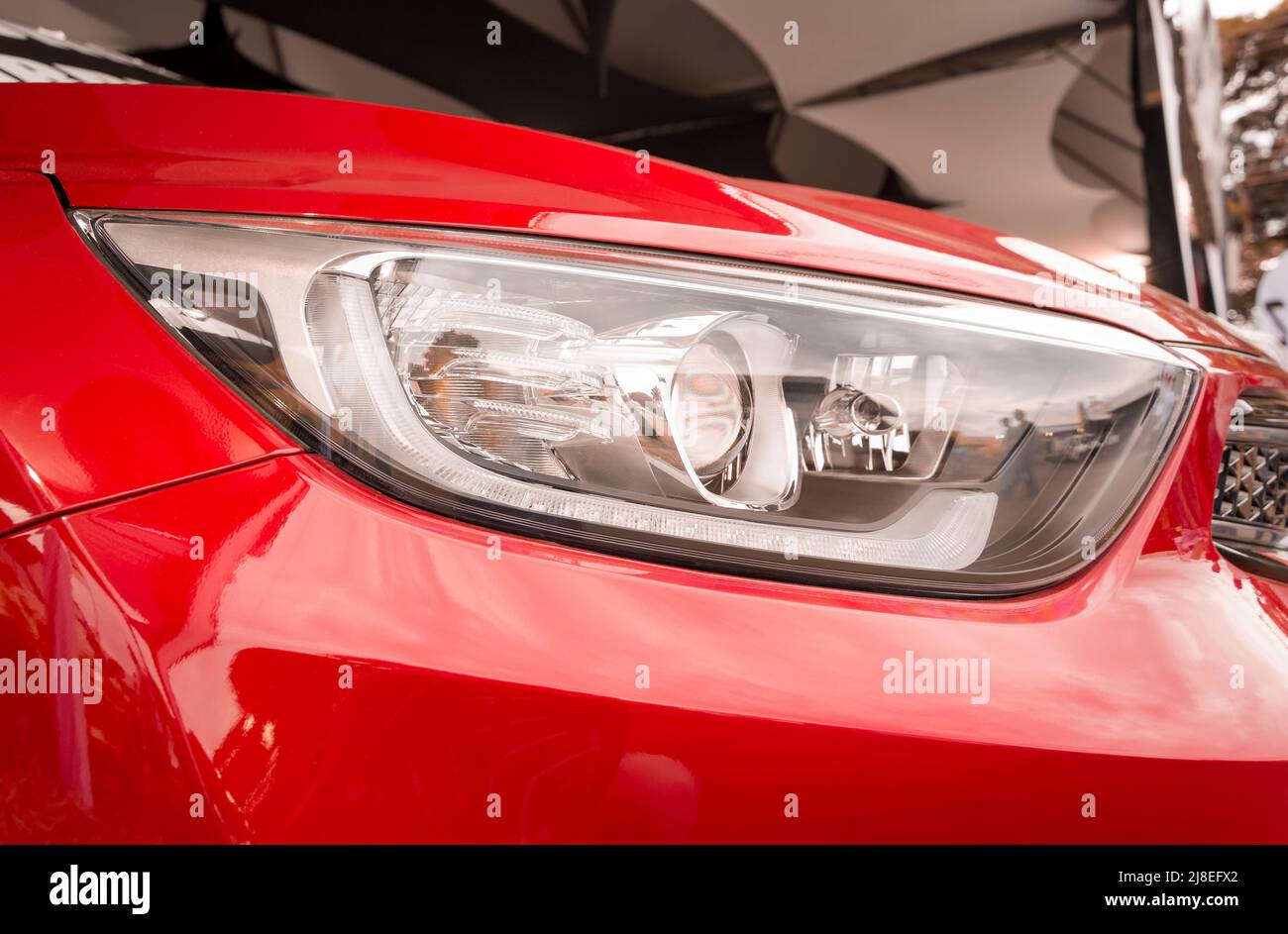 A close up image of a modern car's headlight. Modern lines Stock Photo ...