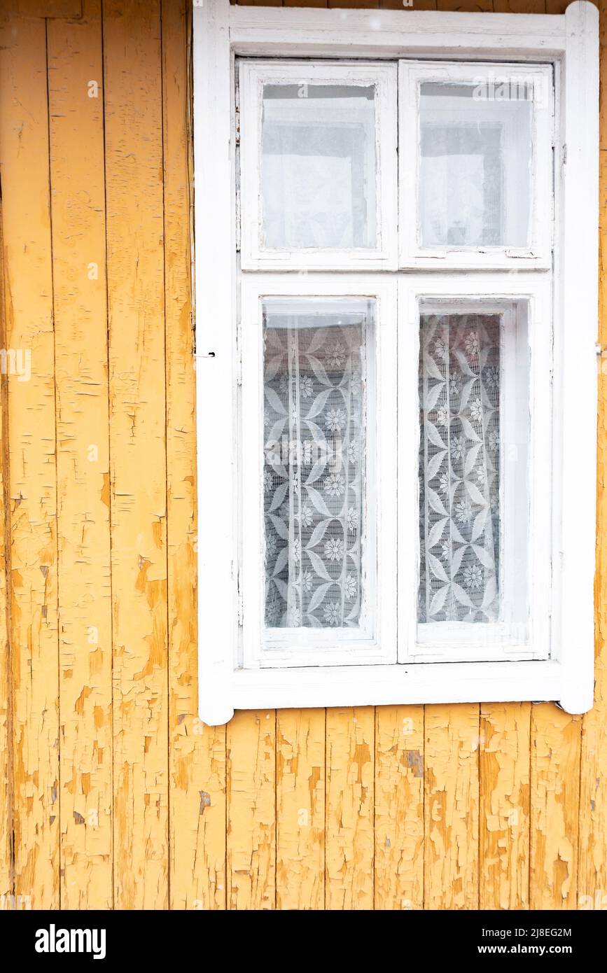 Window in an old wooden house. A decaying rural old wooden house. Wall ...