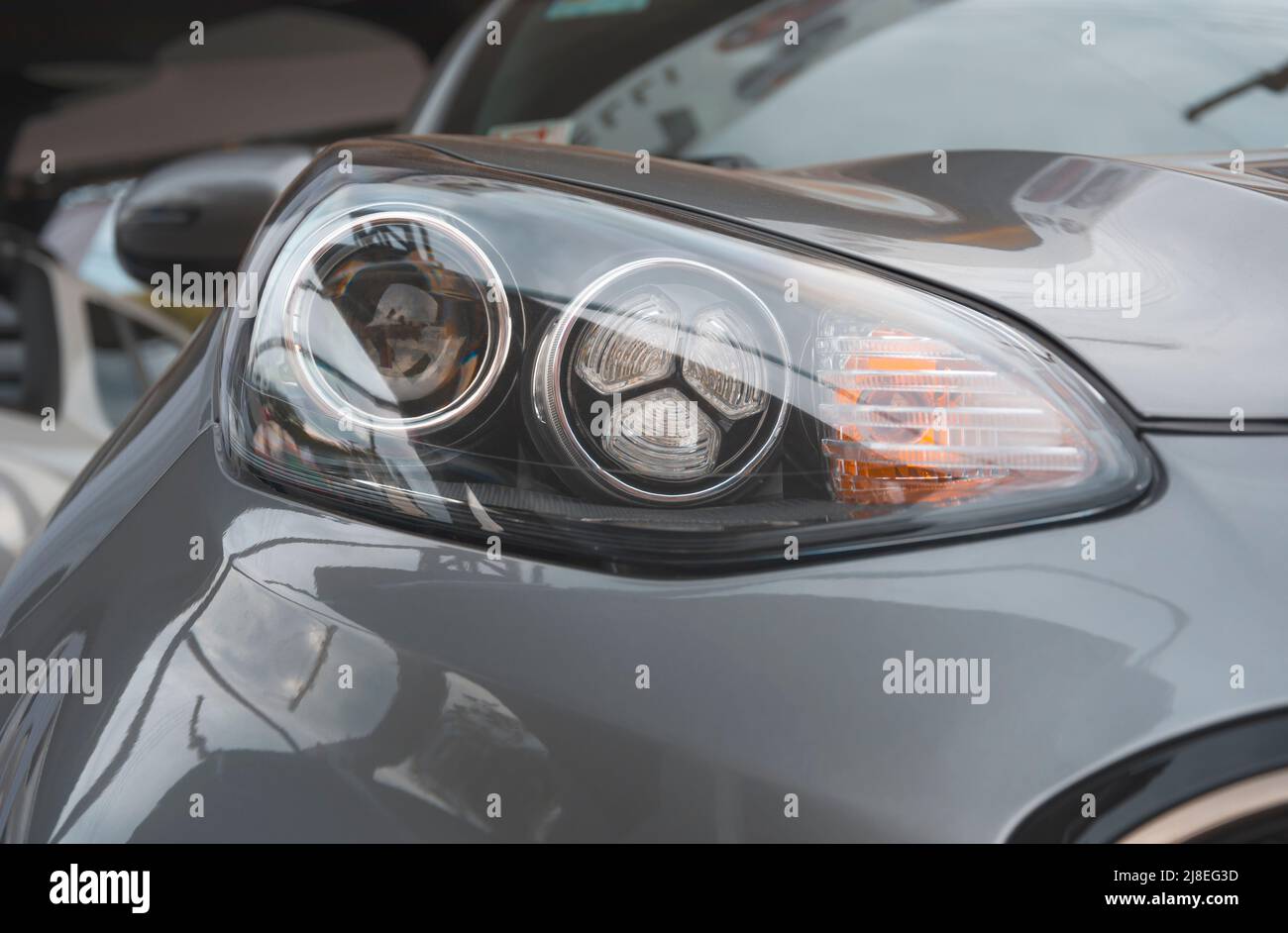 A close up image of a modern car's headlight. Modern lines Stock Photo ...