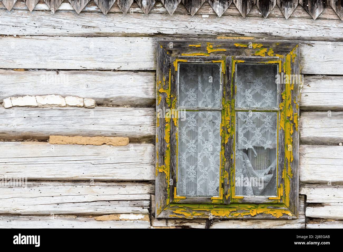 Window in an old wooden house. A decaying rural old wooden house. Wall ...