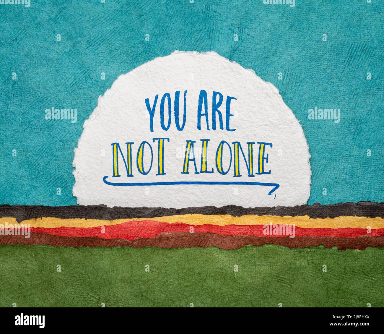 you are not alone - inspirational reminder, handwriting on a circular ...