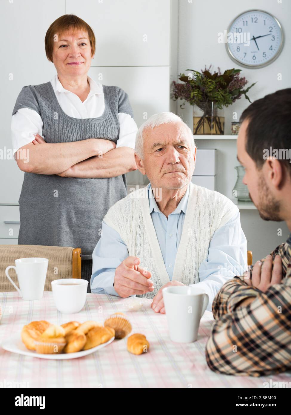 Parents arguing with son Stock Photo - Alamy