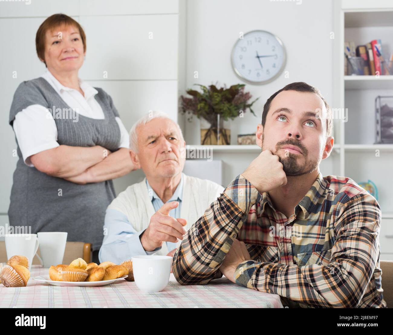 Parents arguing with son Stock Photo - Alamy