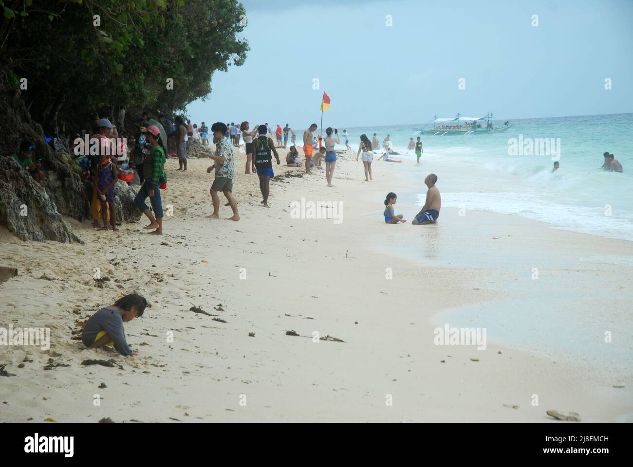 Tourists on Puka Shell Beach, Boracay, The Visayas, Philippines ...