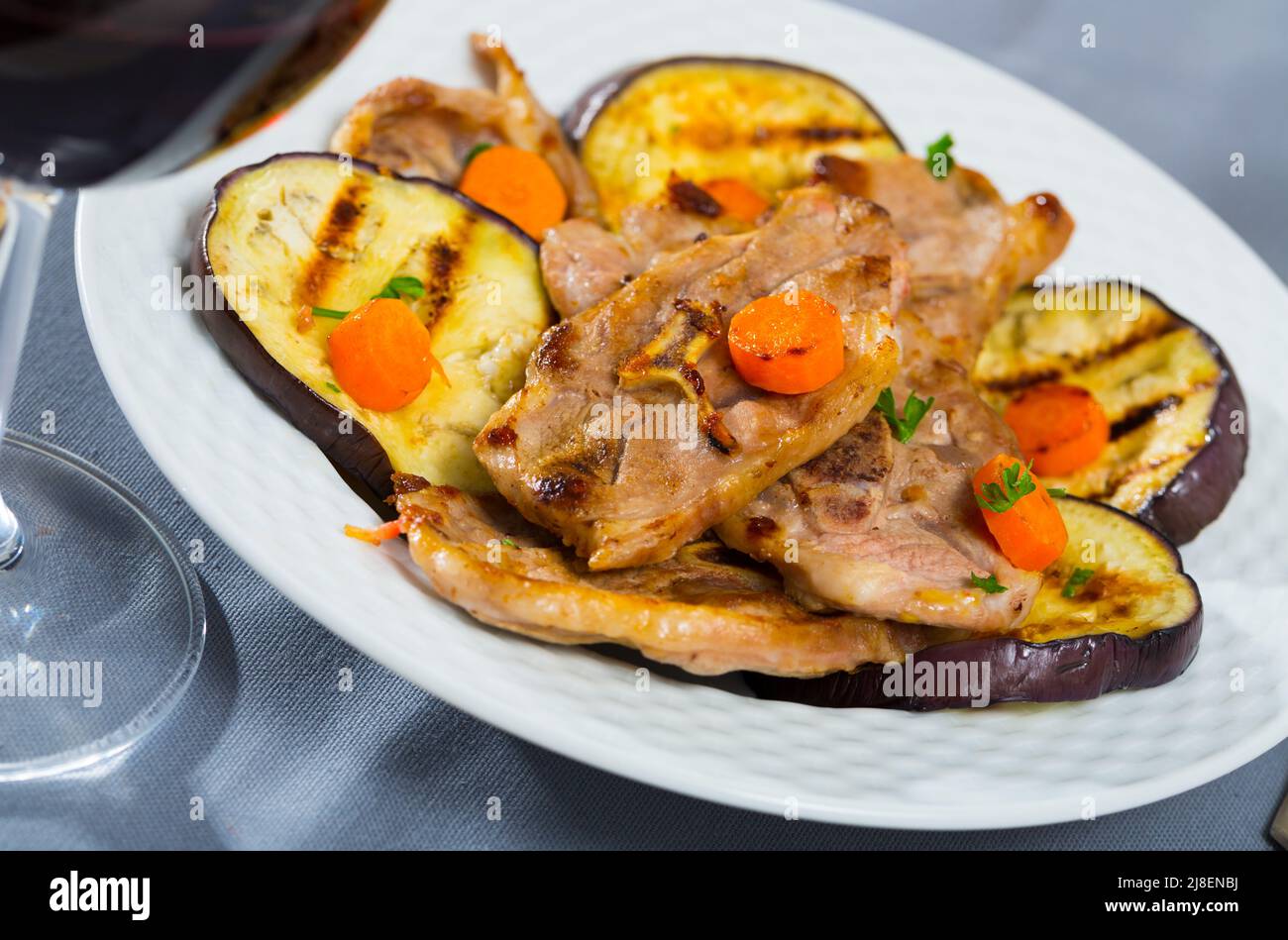 Mutton loin chops grilled with eggplant Stock Photo - Alamy