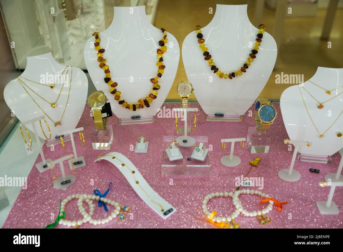 Jewelry made of amber on display Stock Photo - Alamy