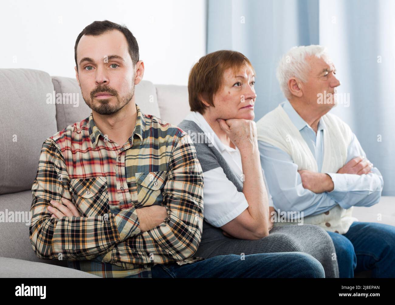 Parents arguing with son Stock Photo - Alamy