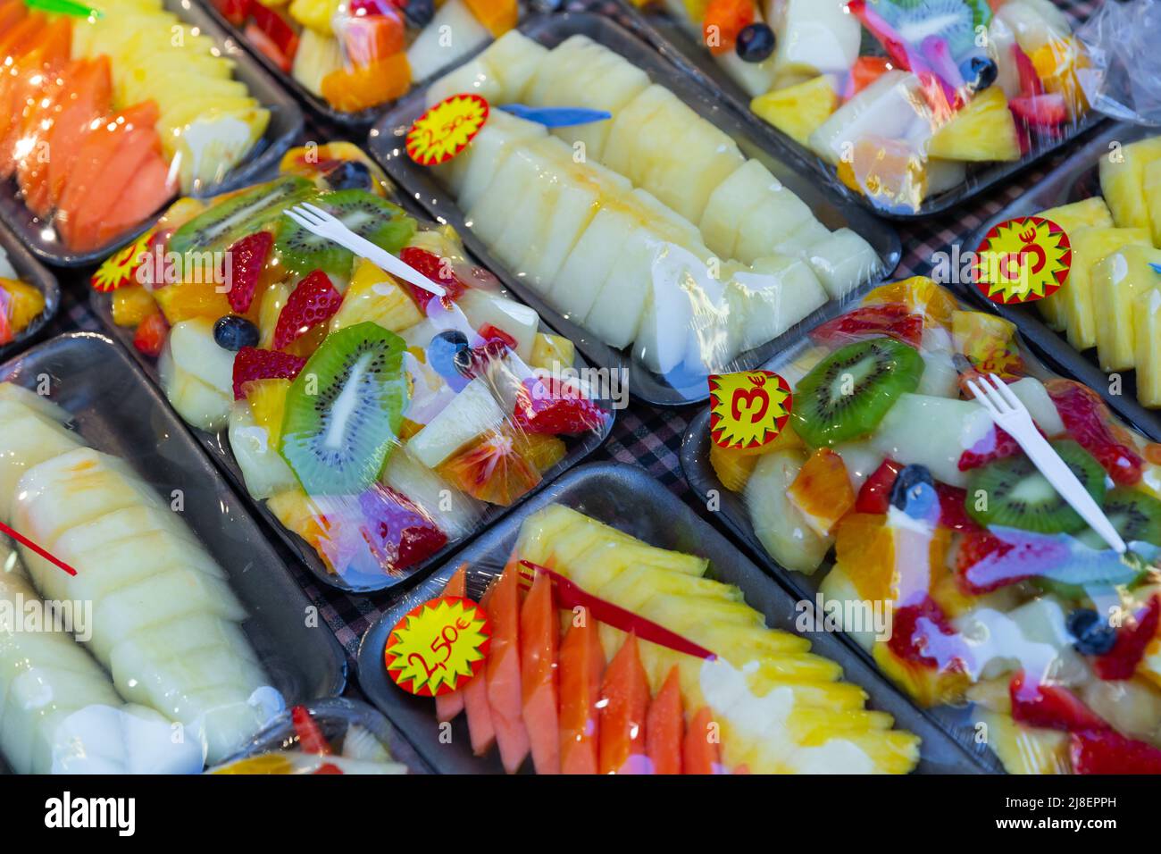 Mixed cut fruits packed for sale Stock Photo - Alamy