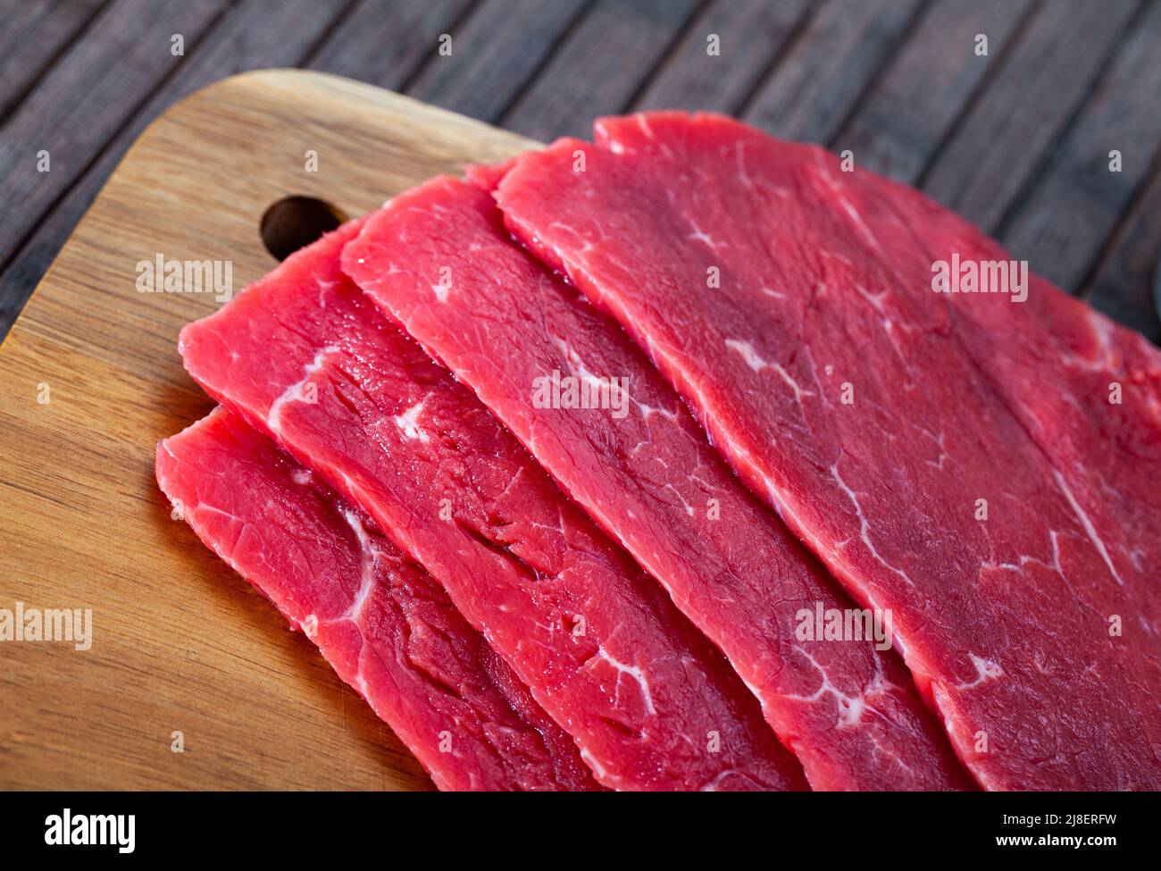 Image of raw a beef fillet cut into pieces Stock Photo - Alamy