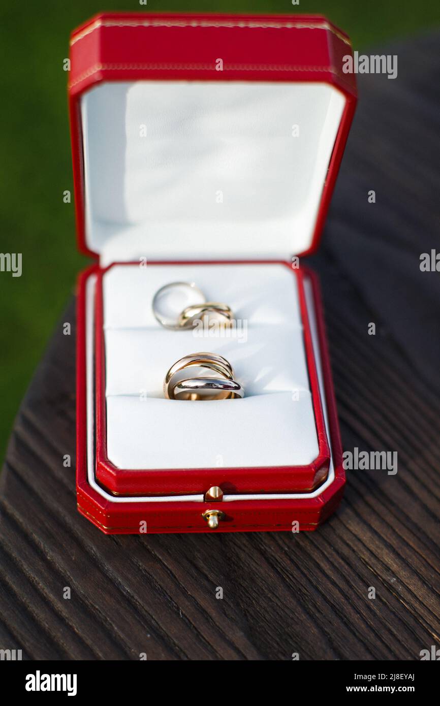 Three wedding rings in a red box Stock Photo - Alamy