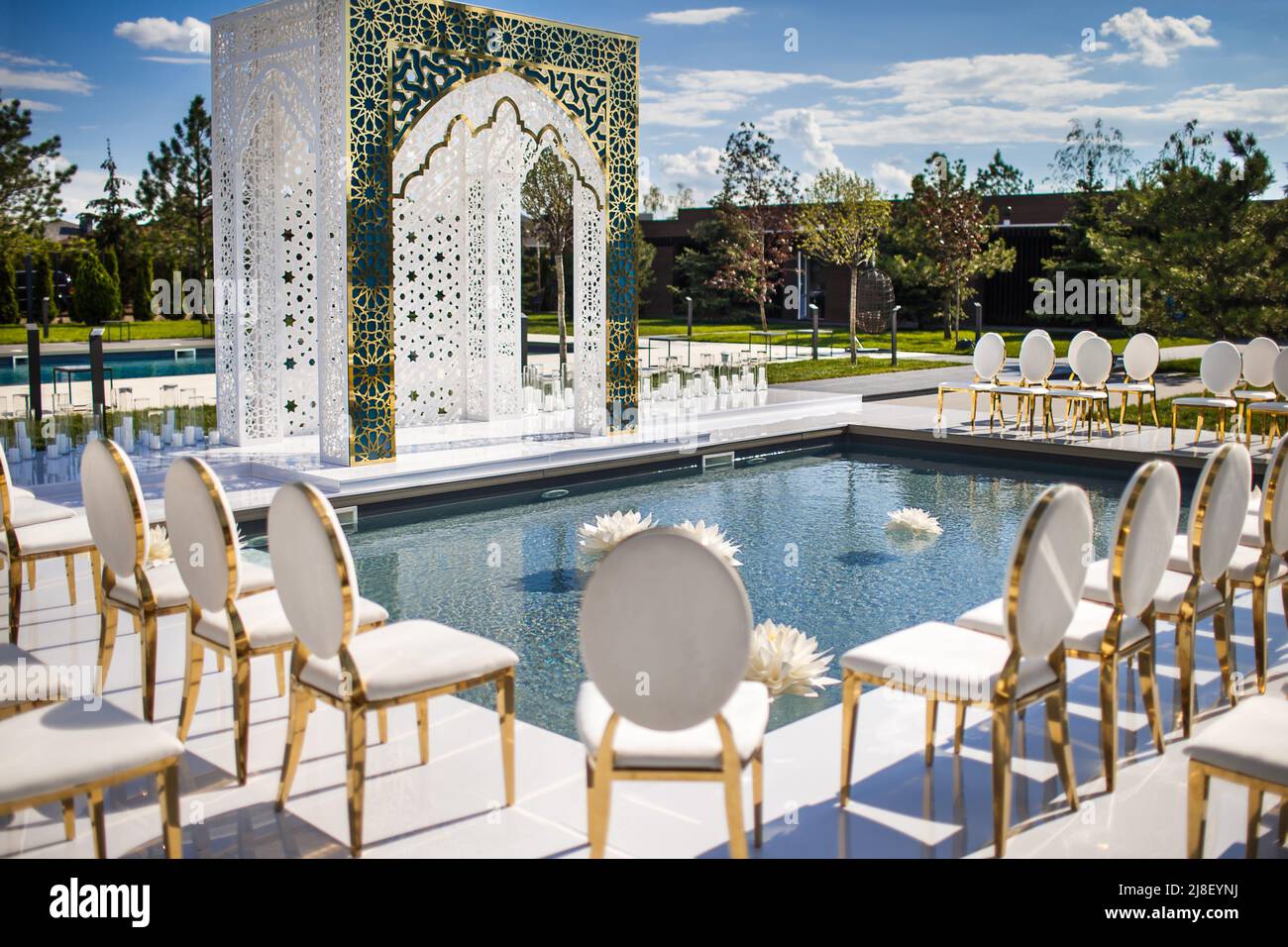 Outdoor wedding ceremony in the garden near the pool Stock Photo - Alamy