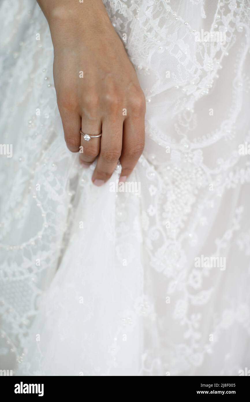 Engagement ring on bride's finger. Wedding day Stock Photo - Alamy
