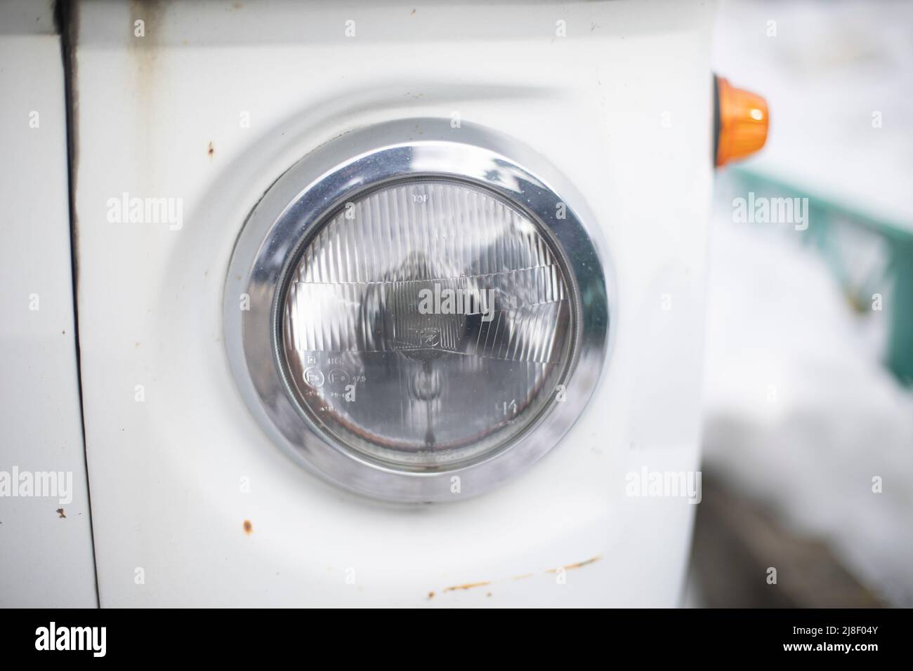 Round car headlight. Retro transport. Details of old car. White car ...