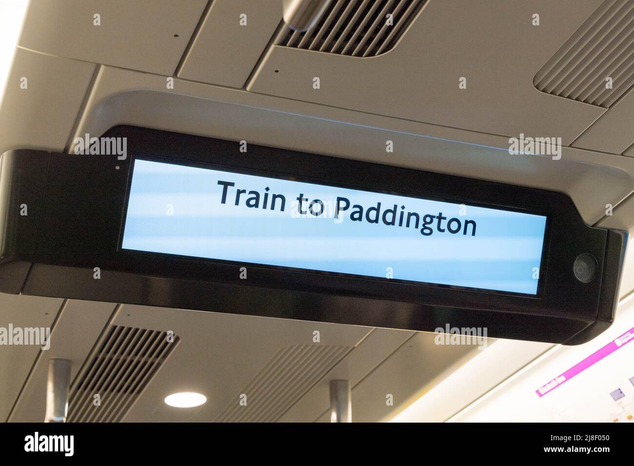"Train to Paddington" shown on a digital display screen onboard purple ...