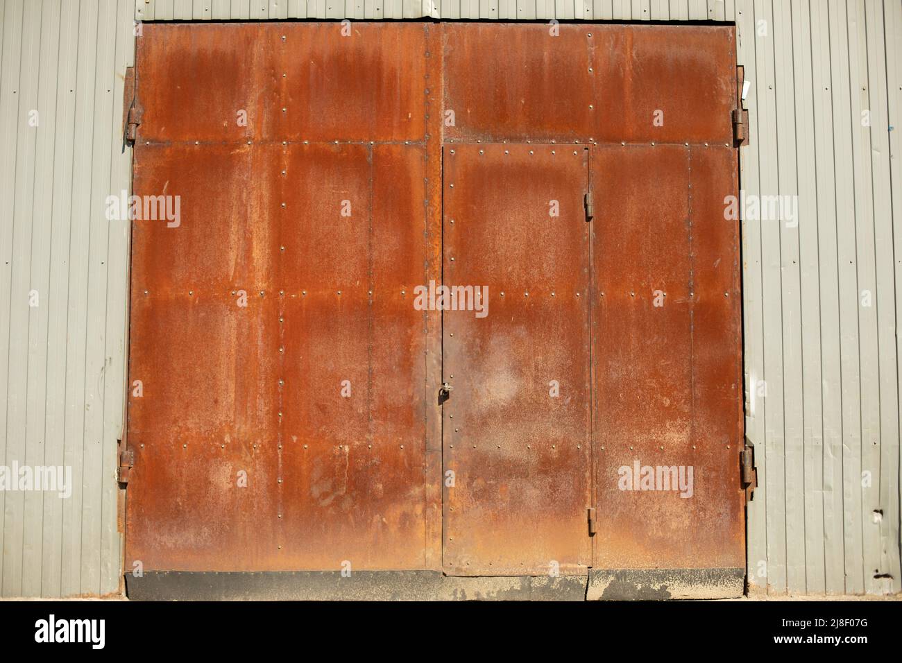 Rusty gates. Steel gates of large size. Rusty metal. Details of ...