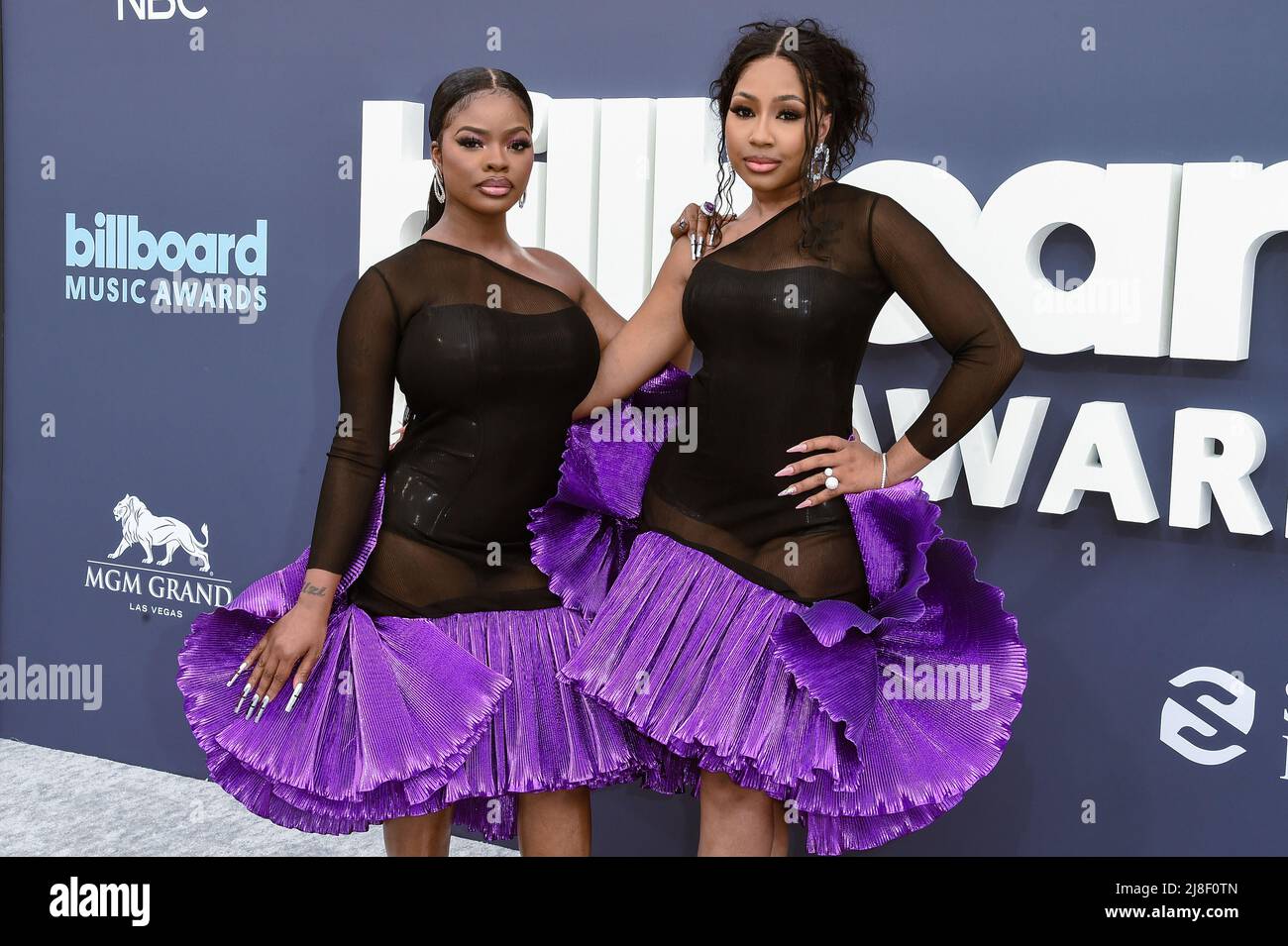 JT, Yung Miami walking on the red carpet at the 2022 Billboard Music ...