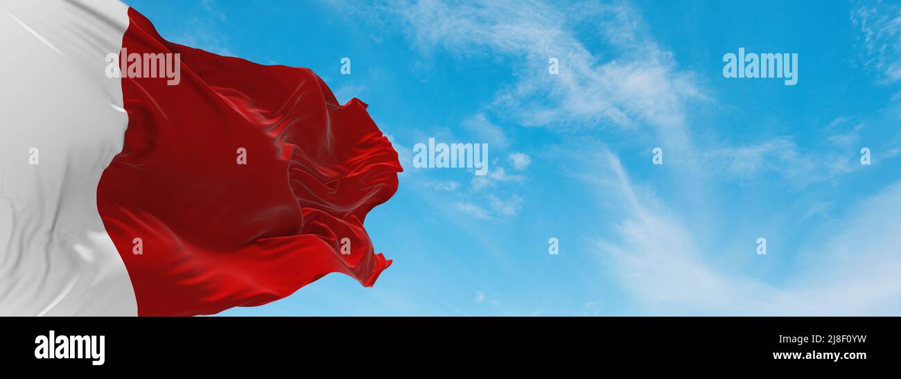 official flag of Ajman , United Arab Emirates at cloudy sky background ...