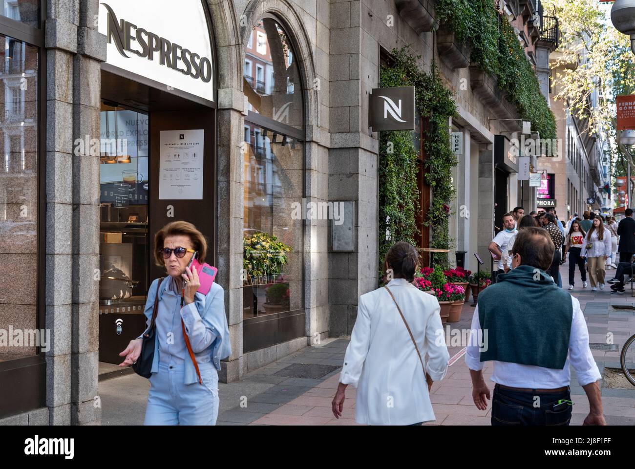Pedestrians walk past the Swiss high-end and world leader in coffee ...
