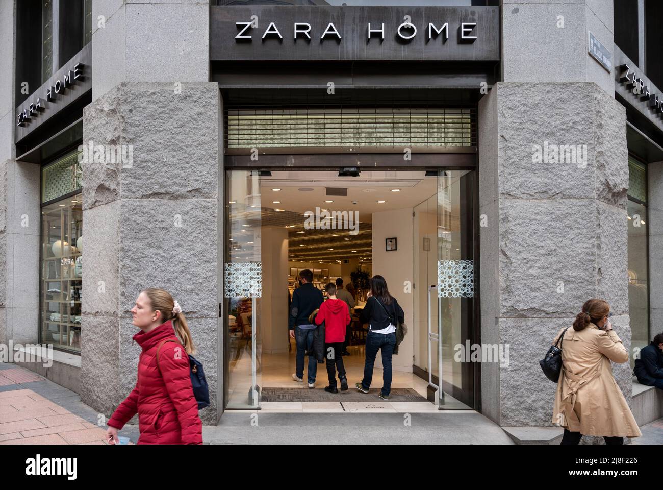 Pedestrians walk past the Spanish Inditex group dedicated to the ...