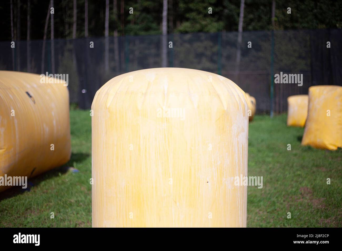Paint ball court. Sports area of yellow soft objects. Training place ...