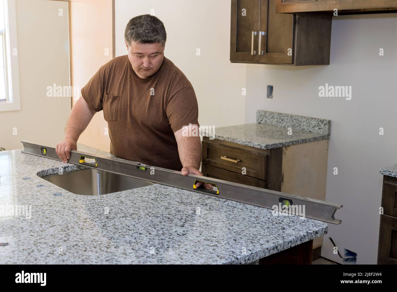 Kitchen island installation hanging level for checks level correctness ...